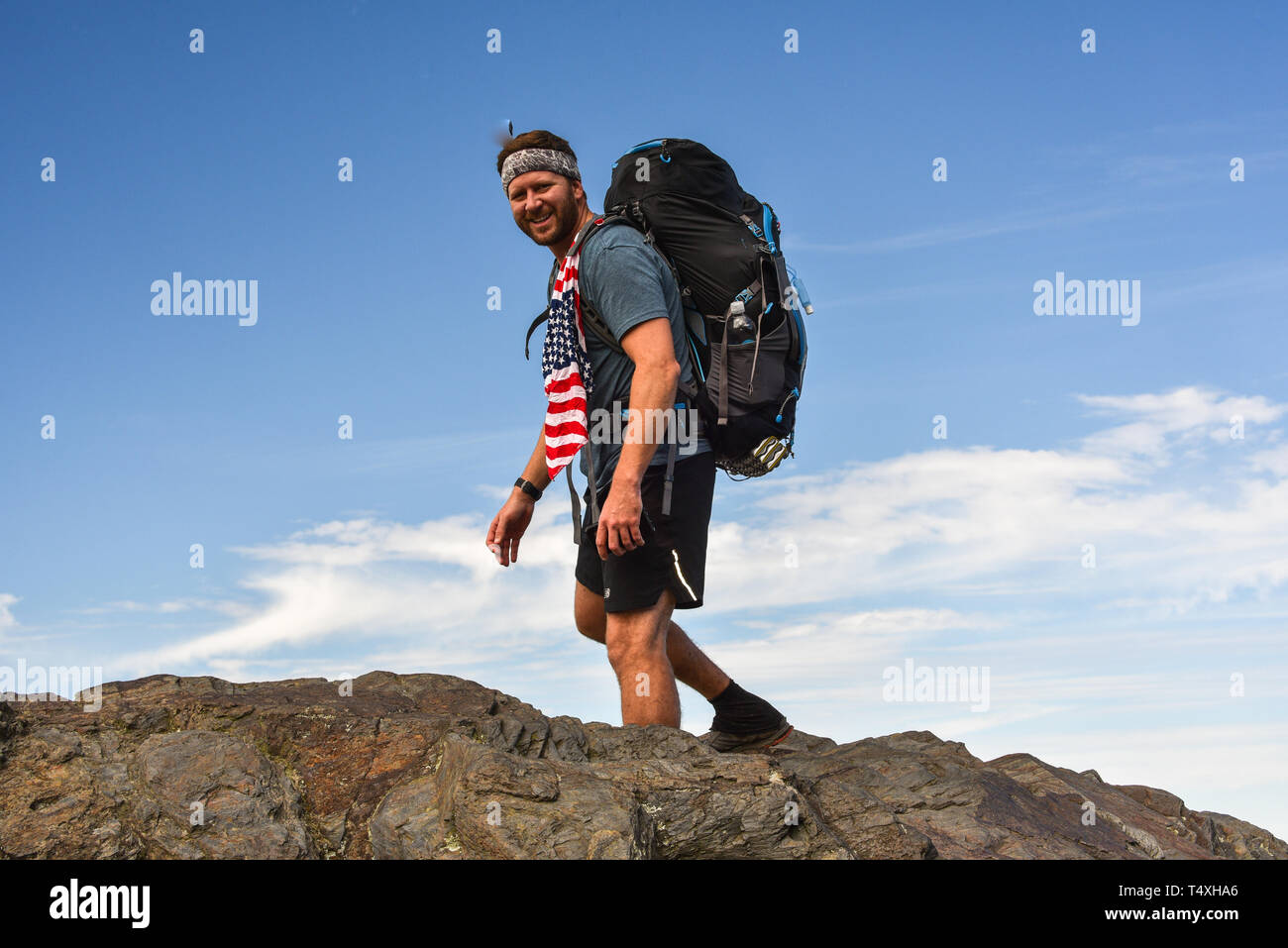Rugged male backpacker hiking on Appalachian Trail, with pack, in the ...