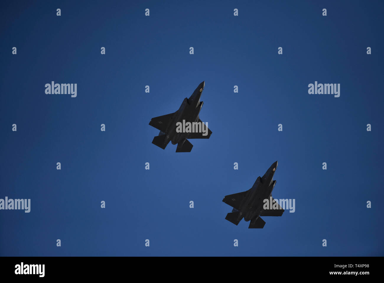 Two F-35A Lightning IIs assigned to the 4th Expeditionary Fighter Squadron fly overhead prior to ...