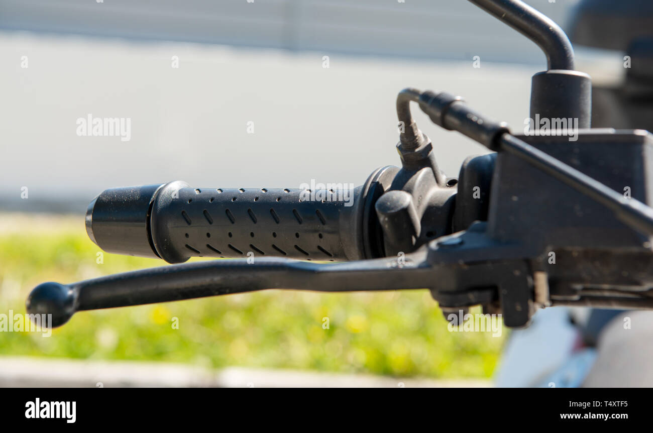 a close up shot of motorcycle brake lever and throttle from top view ...