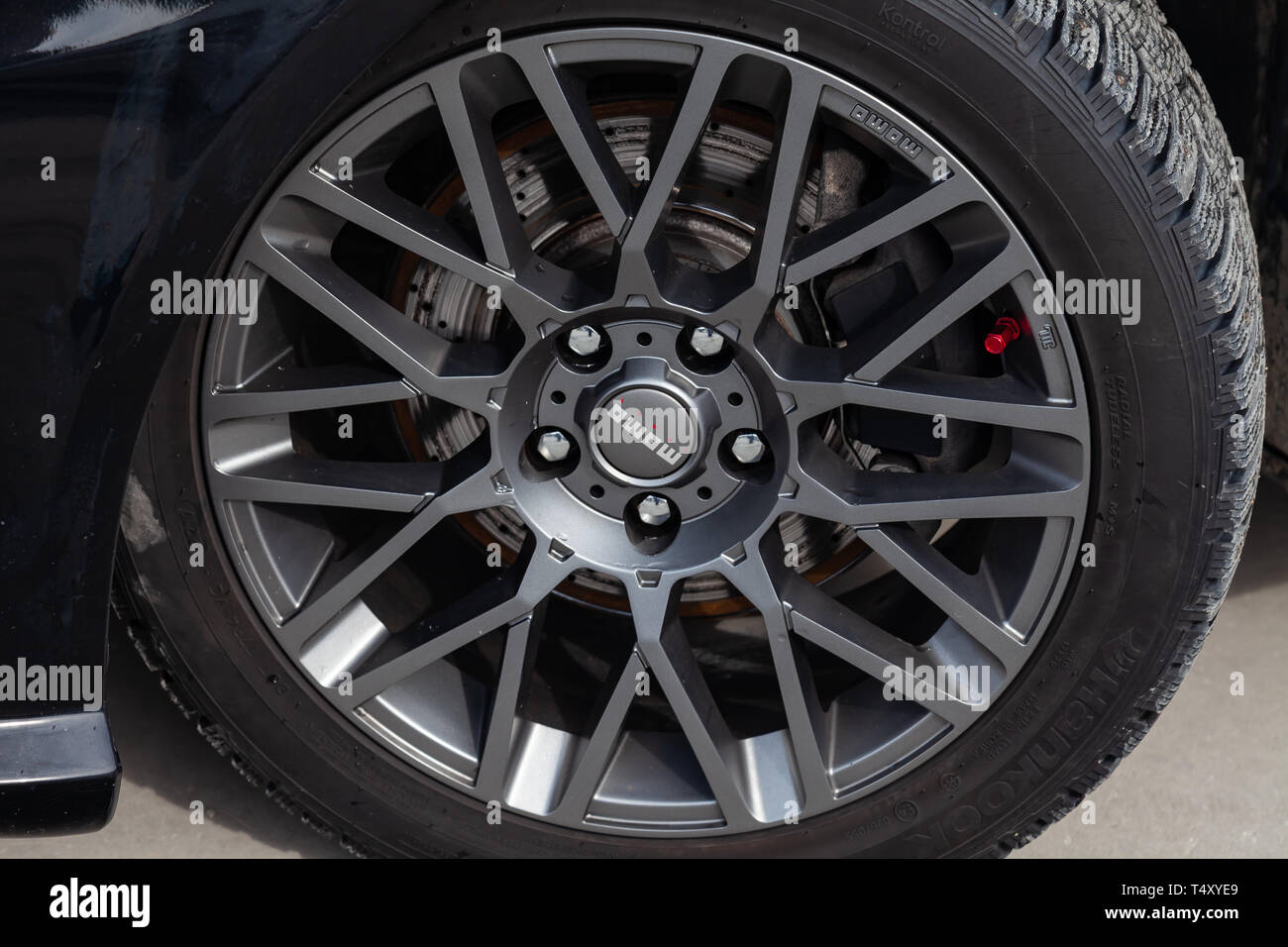 Novosibirsk, Russia - 04.12.2019: Black Mercedes Benz E-class E250 2010 year front Momo disk ...