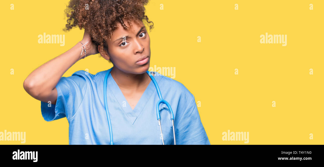 Young african american doctor woman over isolated background confuse ...