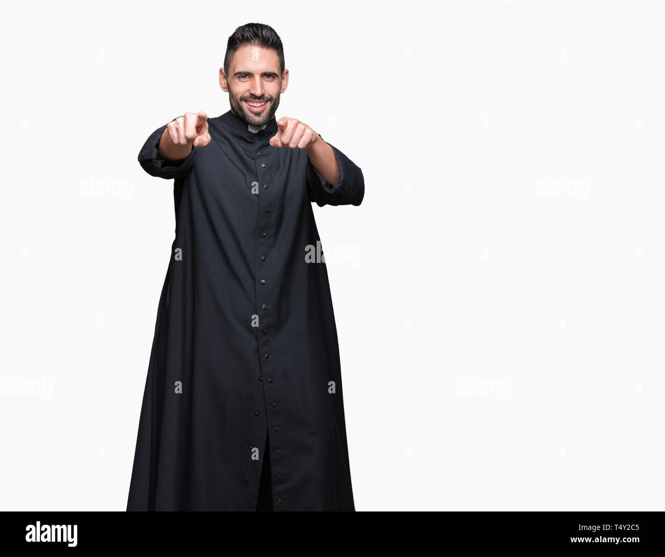 Young Christian priest over isolated background Pointing to you and the ...