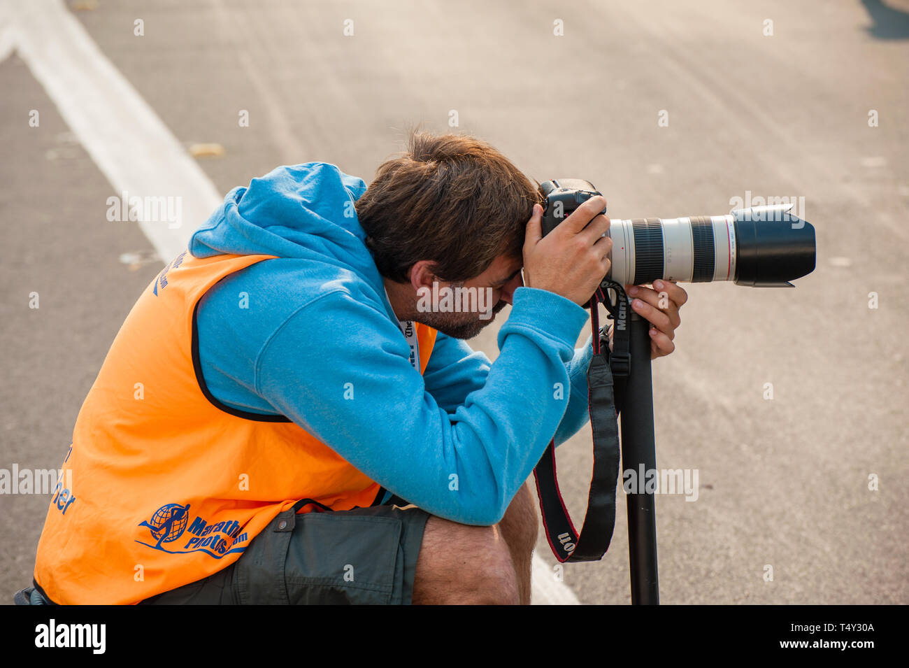 Sydney, Australia - October 27 2019: Official photographer crouching ...