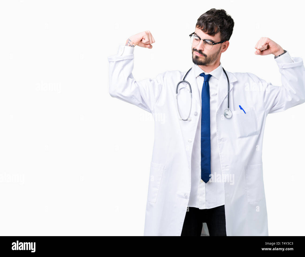 Young doctor man wearing hospital coat over isolated background showing ...