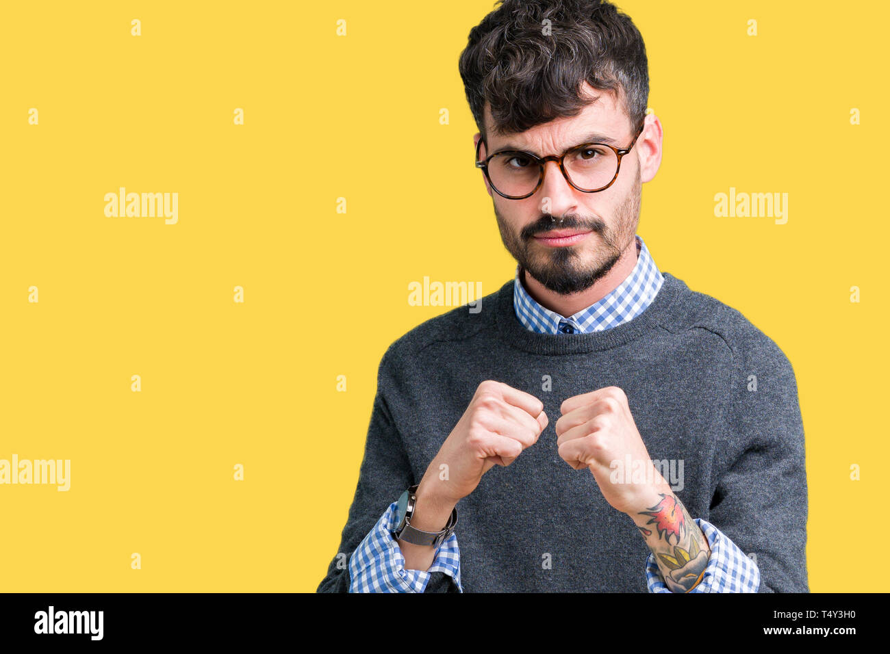 Young handsome smart man wearing glasses over isolated background Ready ...