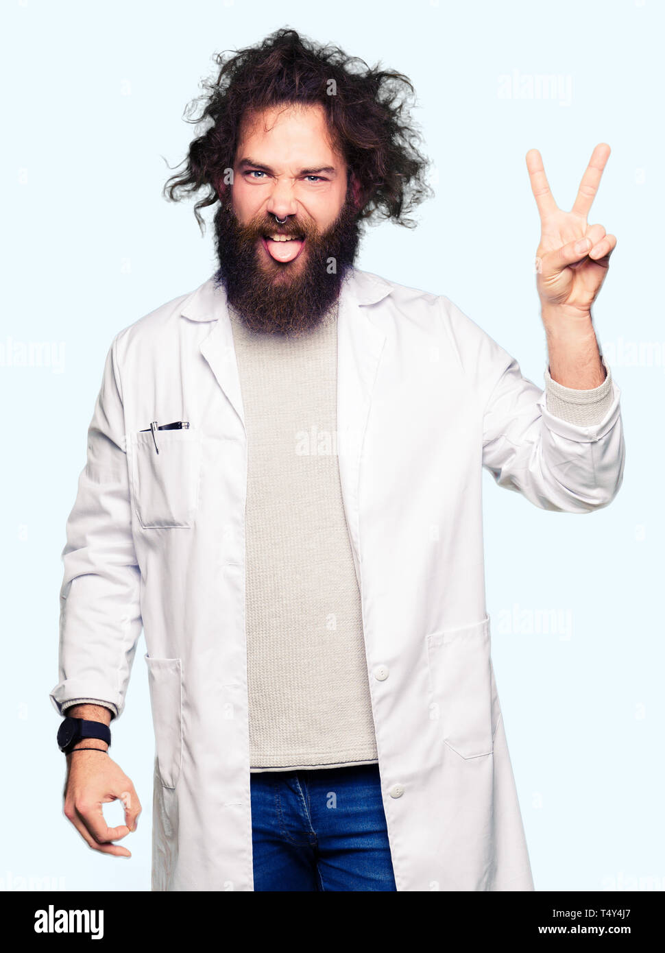 Crazy scientist with funny long hair smiling with happy face winking at ...