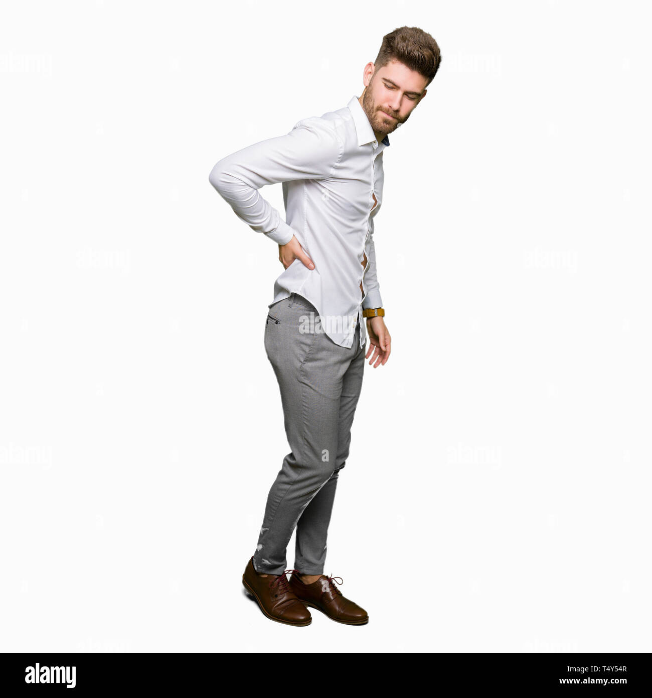 Young handsome business man Suffering of backache, touching back with ...