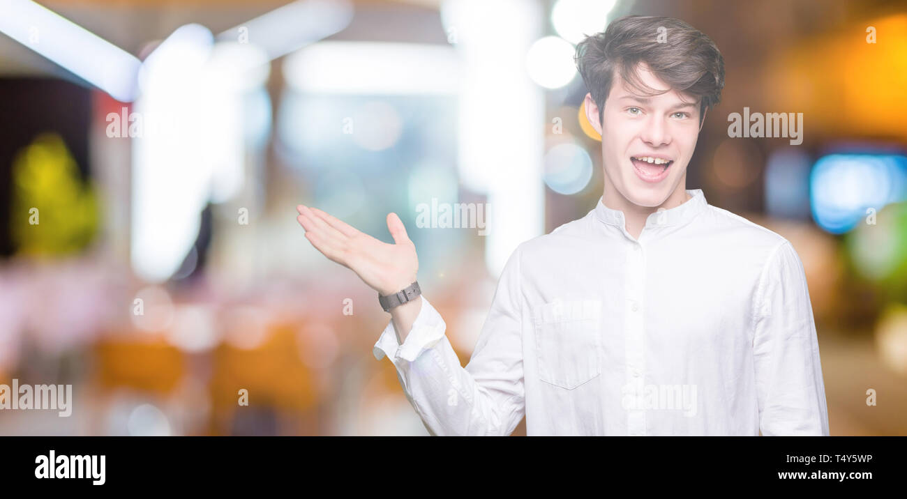 Young handsome business man over isolated background smiling cheerful ...