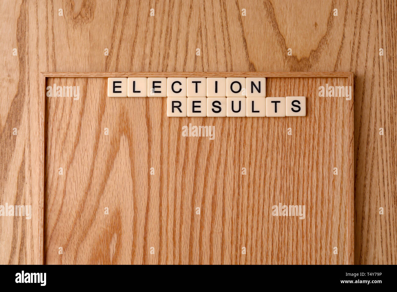 ELECTION RESULTS word block on wood background Stock Photo - Alamy
