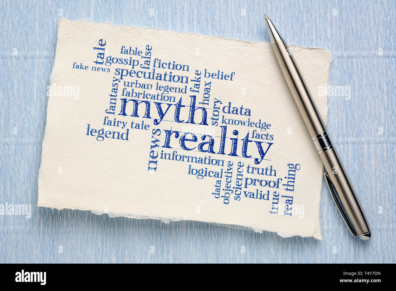myth versus reality word cloud - handwriting on a sheet of rough Khadi ...