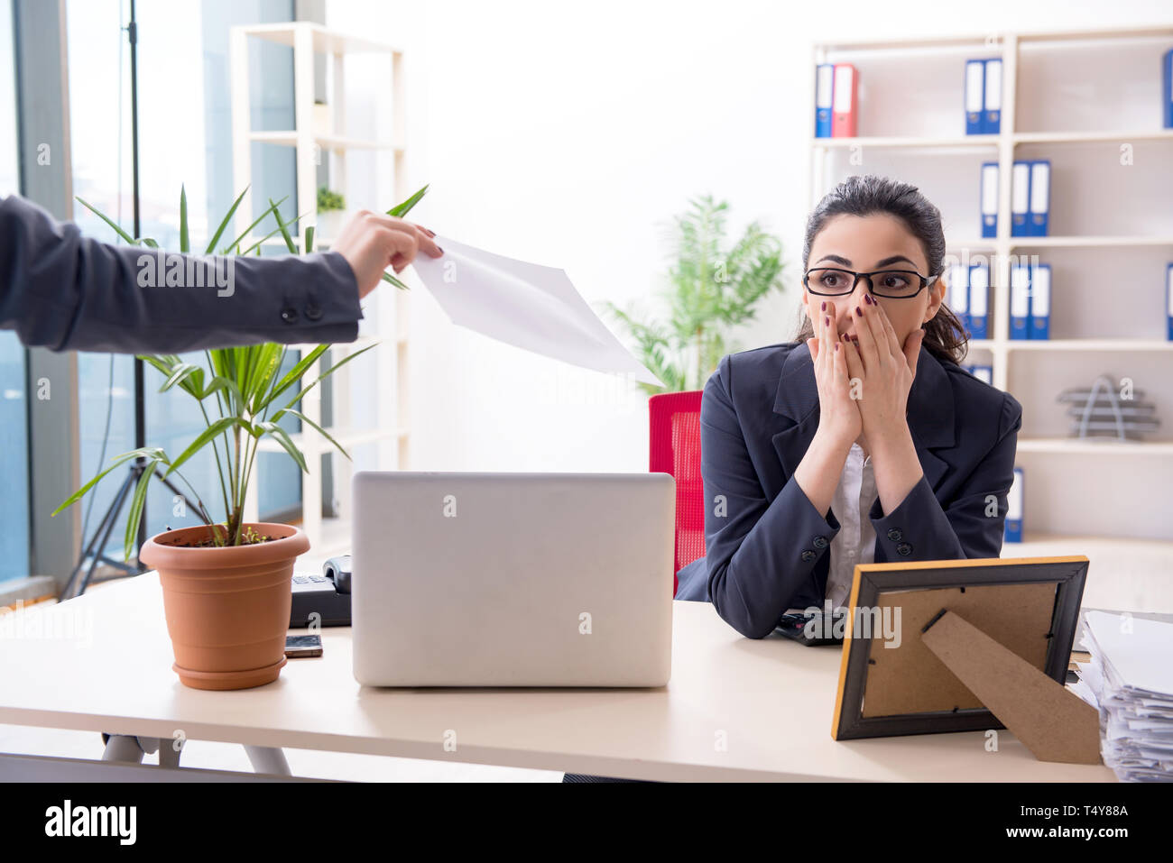 Young female employee being fired from her work Stock Photo - Alamy