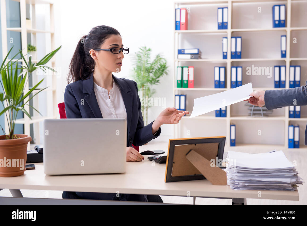 Young female employee being fired from her work Stock Photo - Alamy
