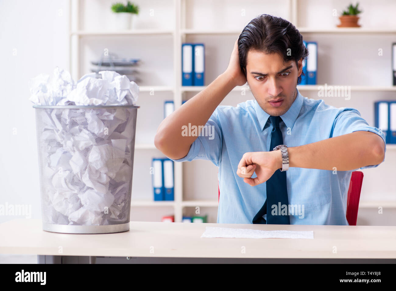 Businessman rejecting new ideas with lots of papers Stock Photo - Alamy