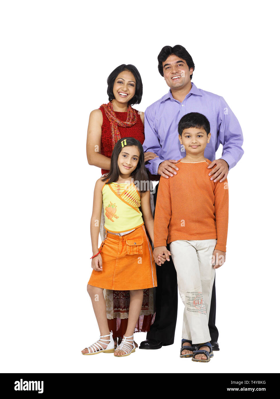 PORTRAIT OF AN INDIAN FAMILY OF FOUR DRESSED IN CASUAL CLOTHES Stock ...