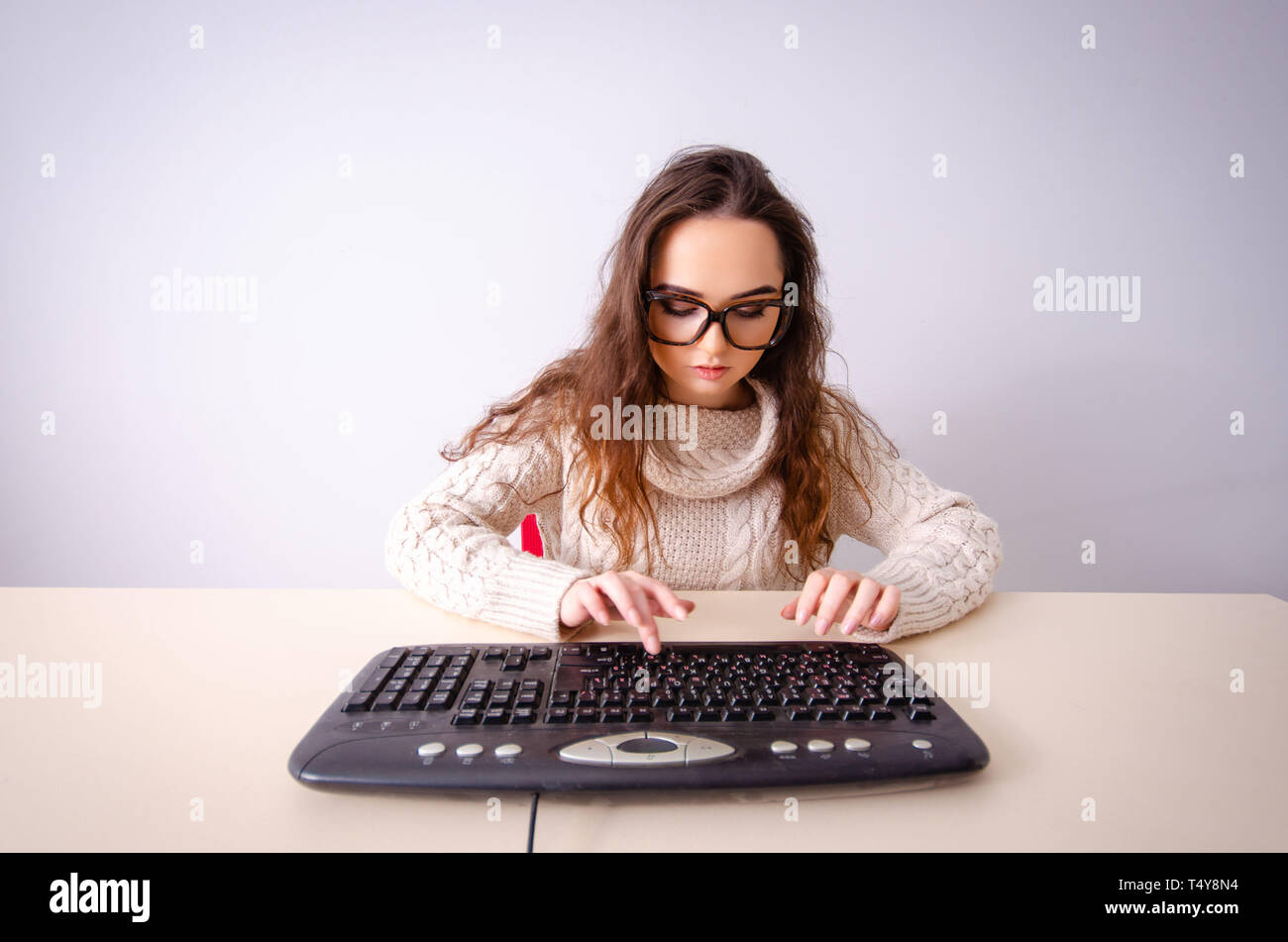 Funny nerd girl working on computer Stock Photo - Alamy