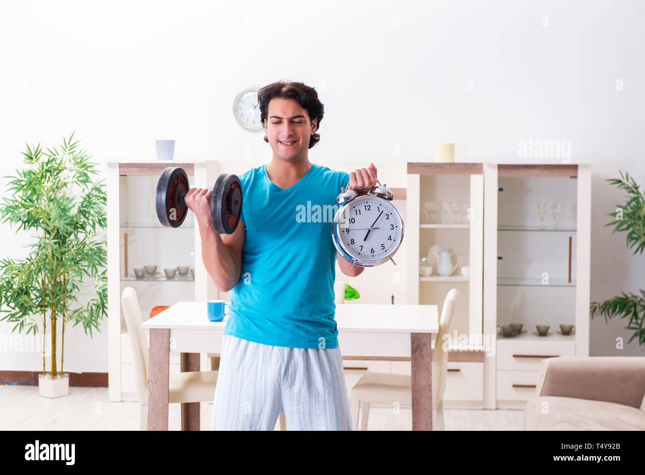 Young handsome man doing morning exercises Stock Photo - Alamy