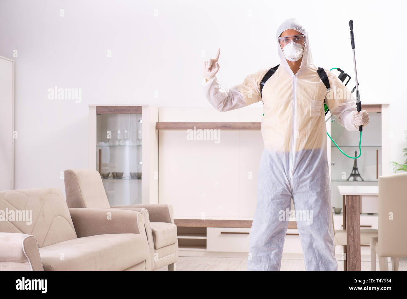 Pest control contractor working in the flat Stock Photo - Alamy