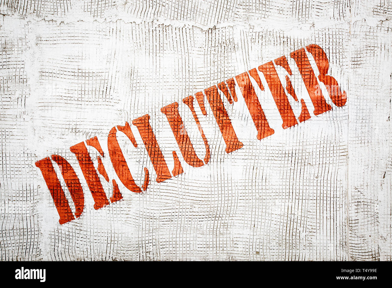 declutter - red graffiti style sign on a white stucco wall Stock Photo ...