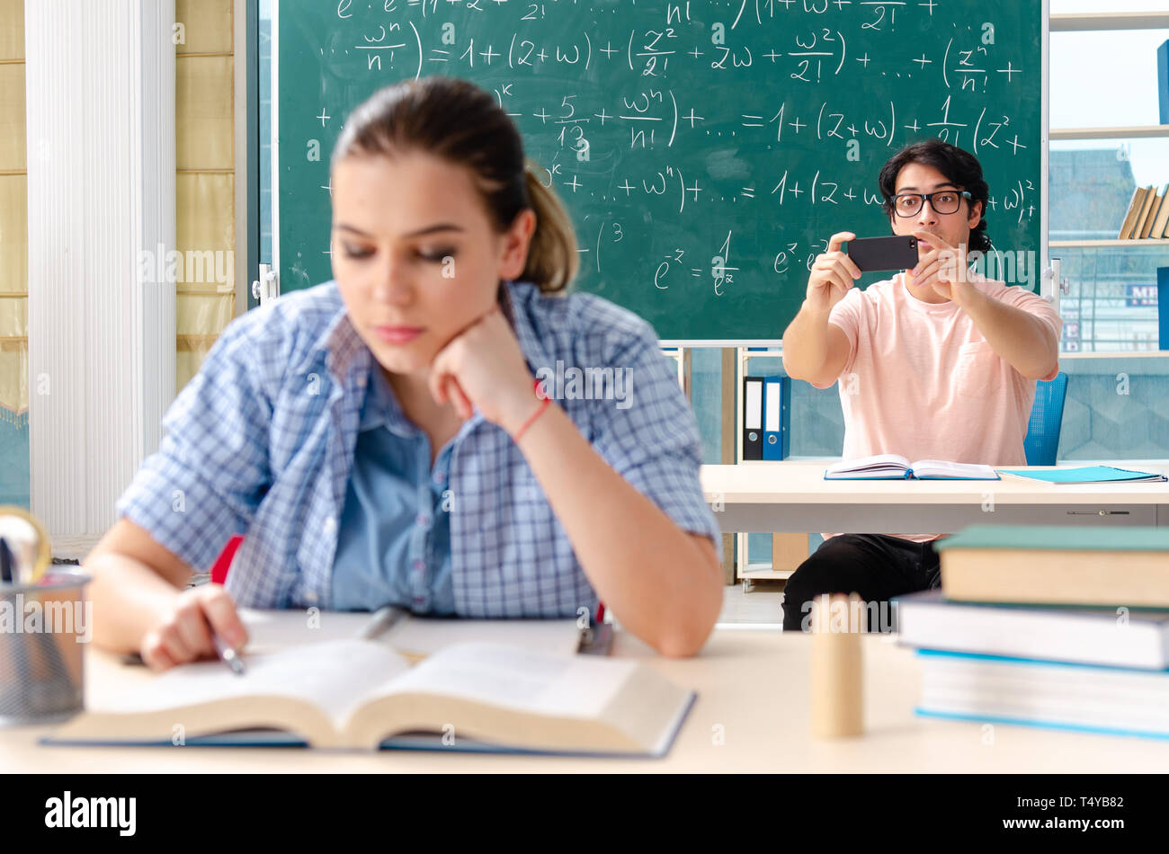 Young students taking the math exam in classroom Stock Photo - Alamy