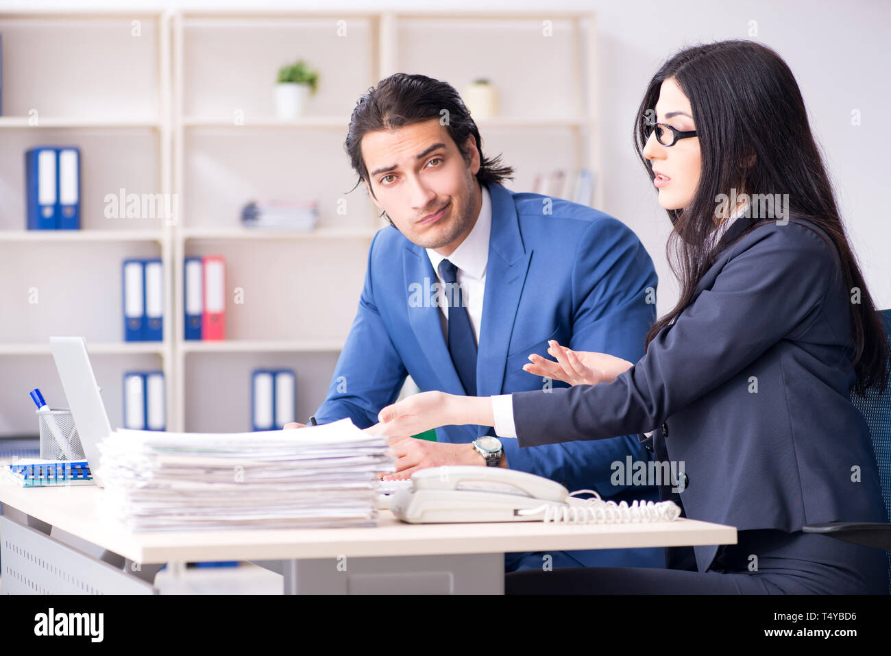 Two employees working in the office Stock Photo - Alamy