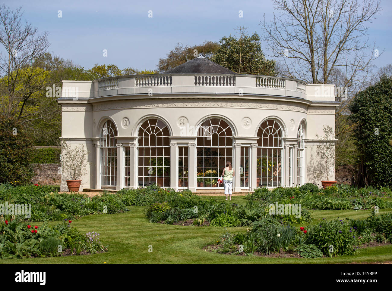 A visitor looks at the newly-restored Garden House at National Trust's ...
