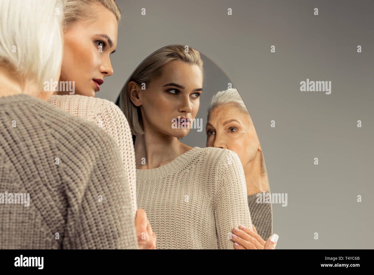 Beautiful nice young woman turning her head Stock Photo - Alamy
