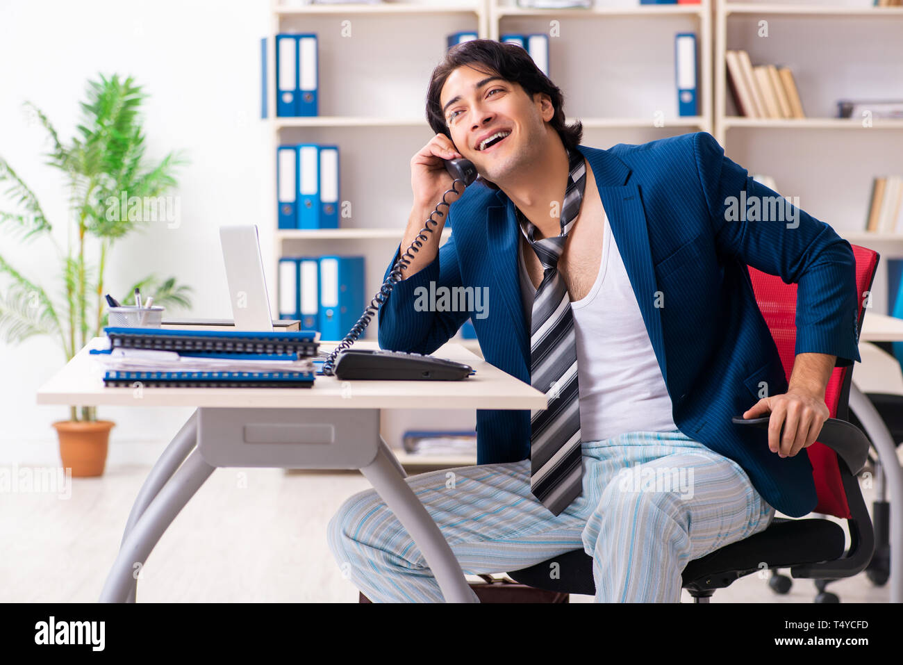 Employee coming to work straight from bed Stock Photo - Alamy