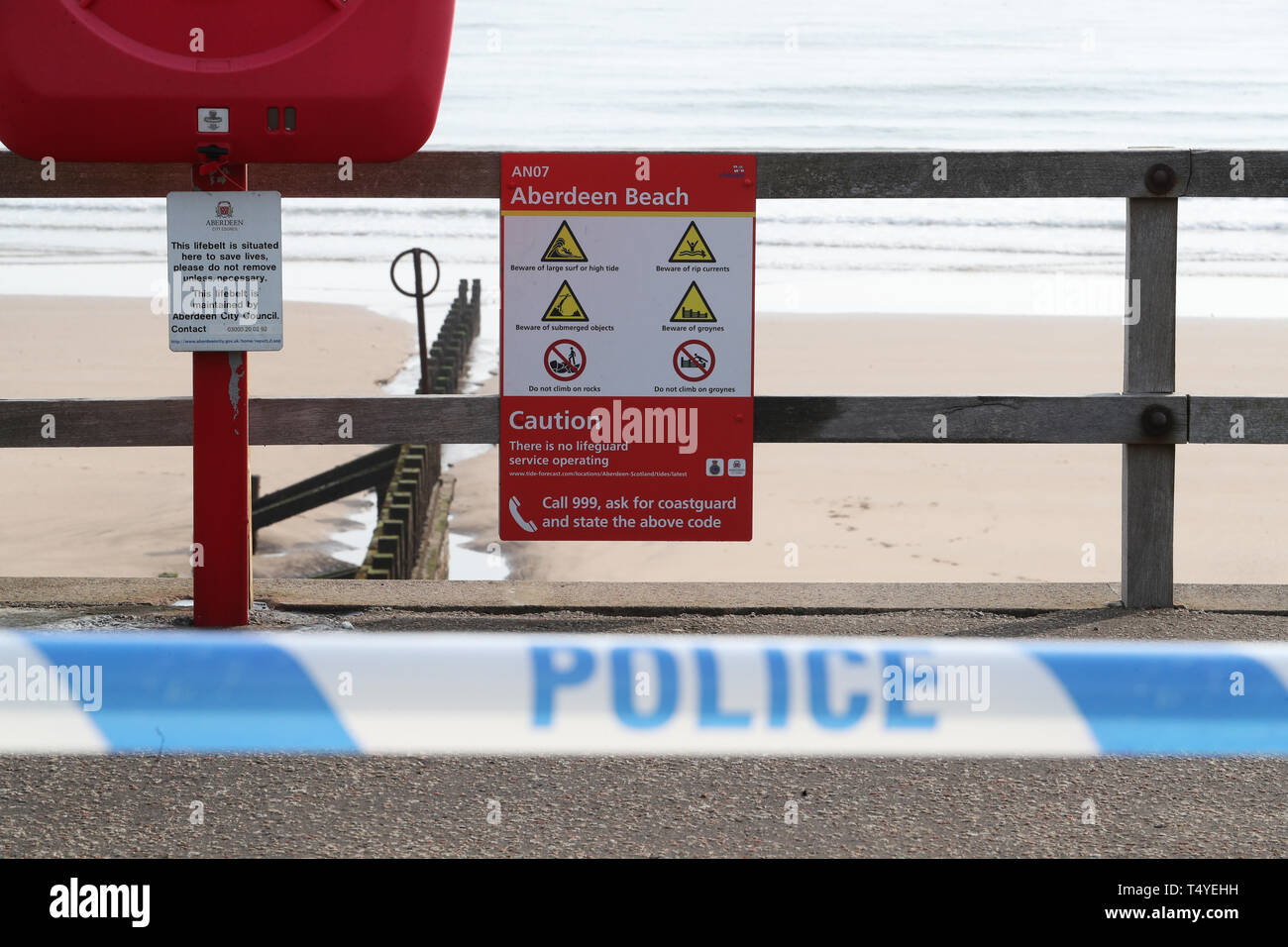 Warning signs inside a police cordon on Aberdeen beach where two people ...