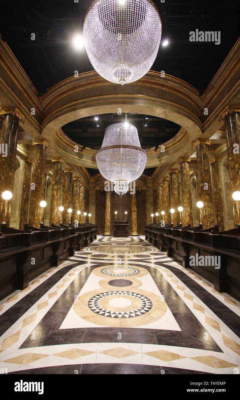 Warwick Davis with James and Oliver Phelps attend the reveal of the ...