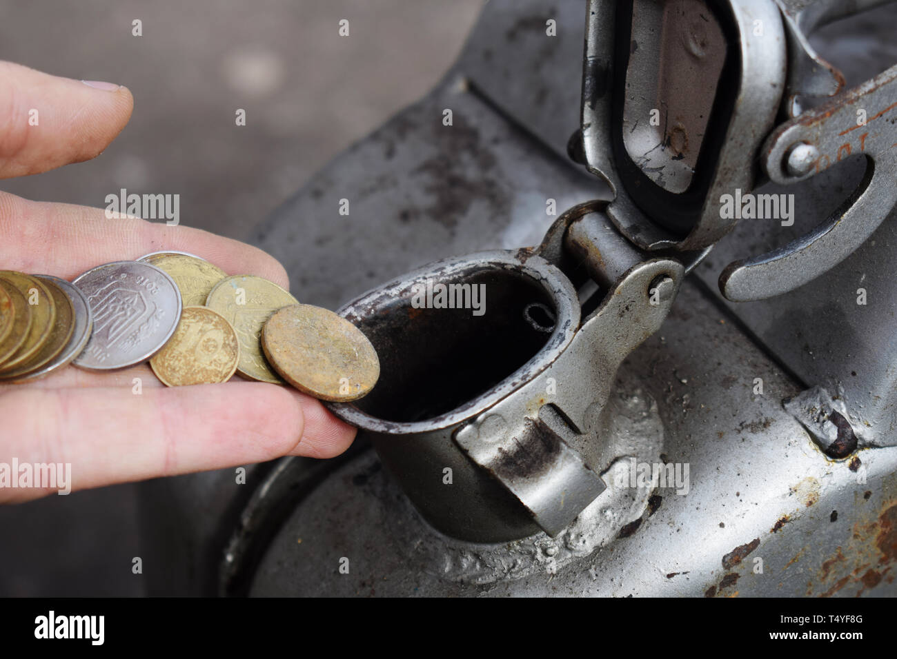 Payment for the gas, fuel, gasoline, diesel concept. Hand dropping ...