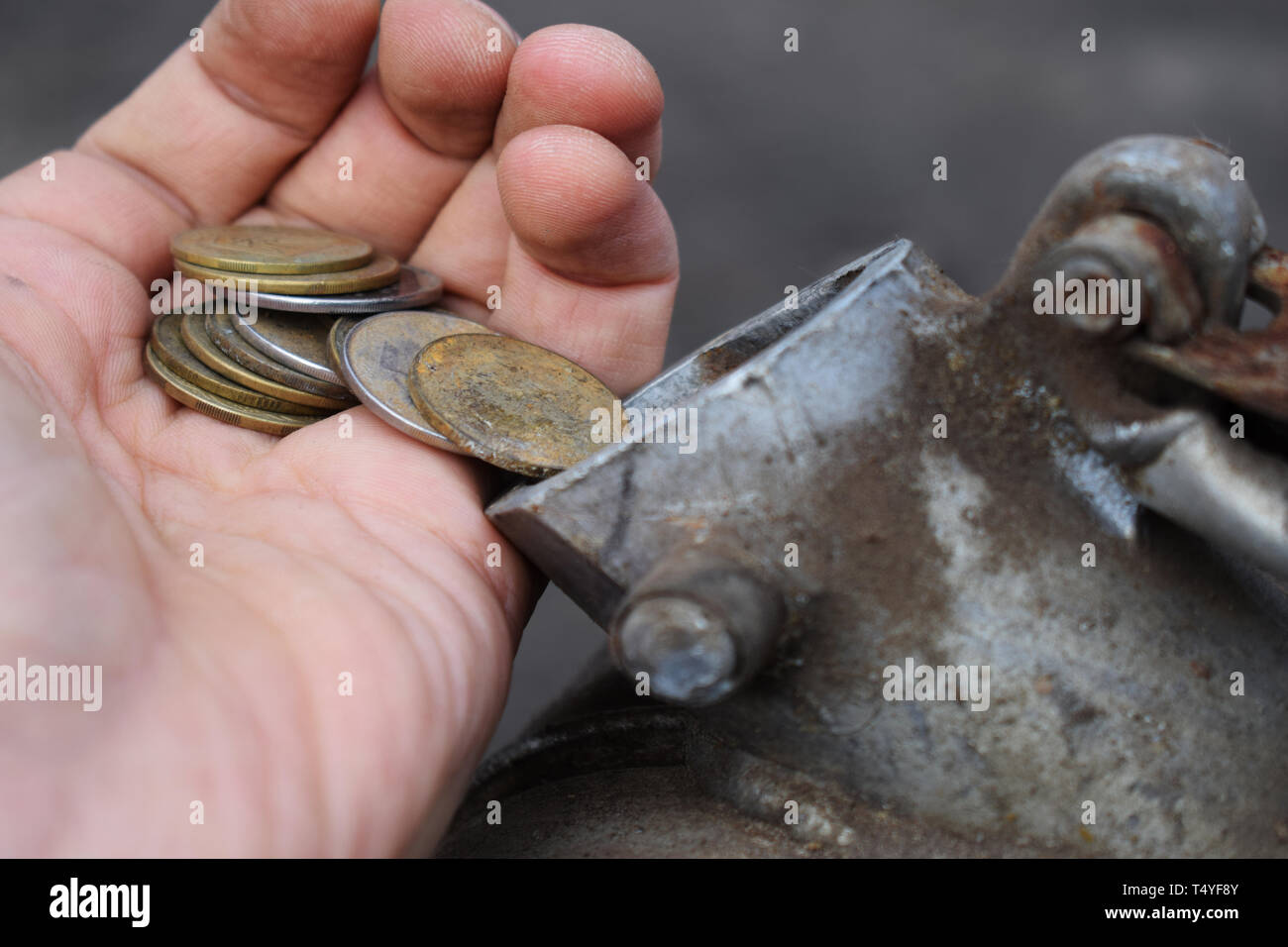 Payment for the gas, fuel, gasoline, diesel concept. Hand dropping ...