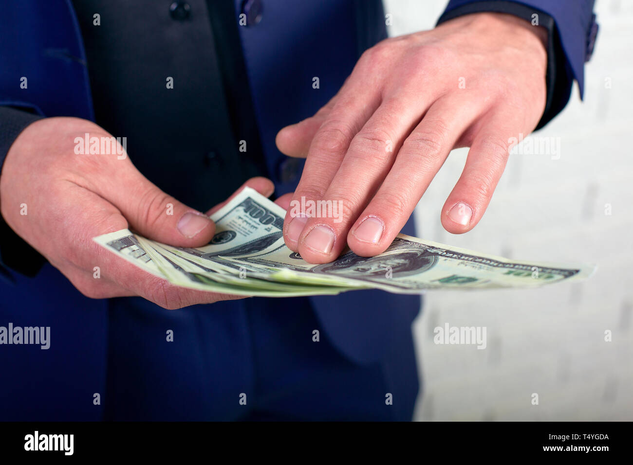 Businessman throwing money on white background. Man in suit wear ...