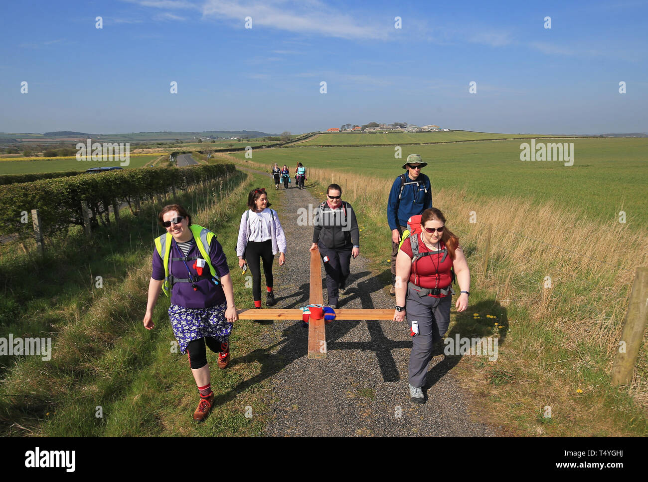 Pilgrims carrying crosses to the Holy Island of Lindisfarne in ...