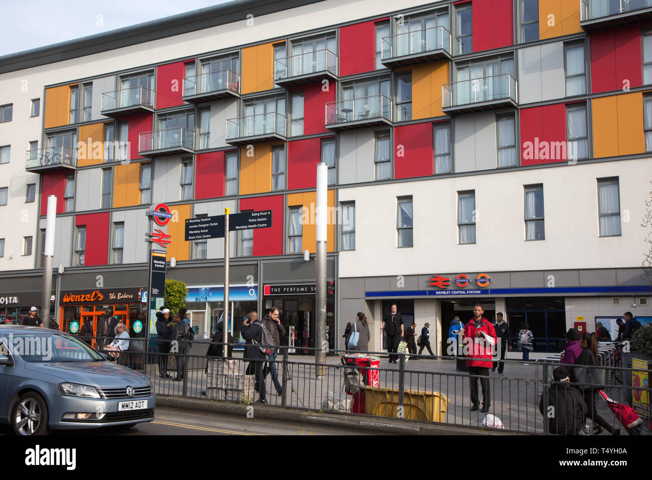 Wembley Central Station entrance on High Road, Wembley busy with ...