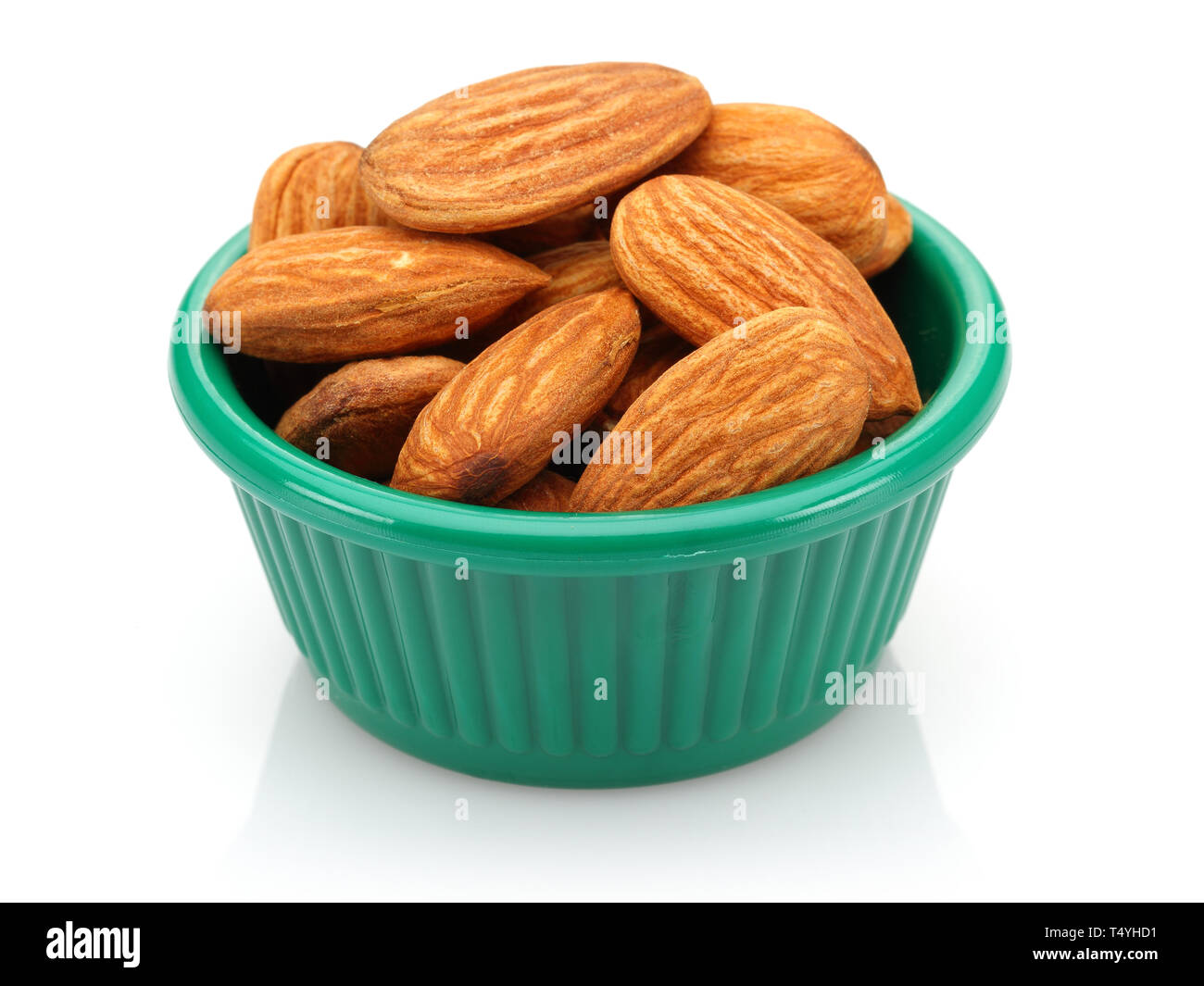 Almonds in the bowl isolated on white background Stock Photo - Alamy