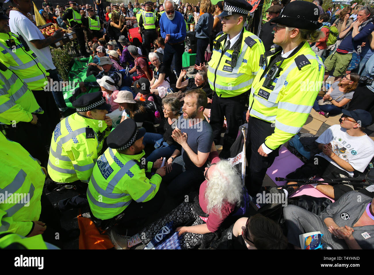 Police talk to an Extinction Rebellion demonstrator on Waterloo Bridge ...