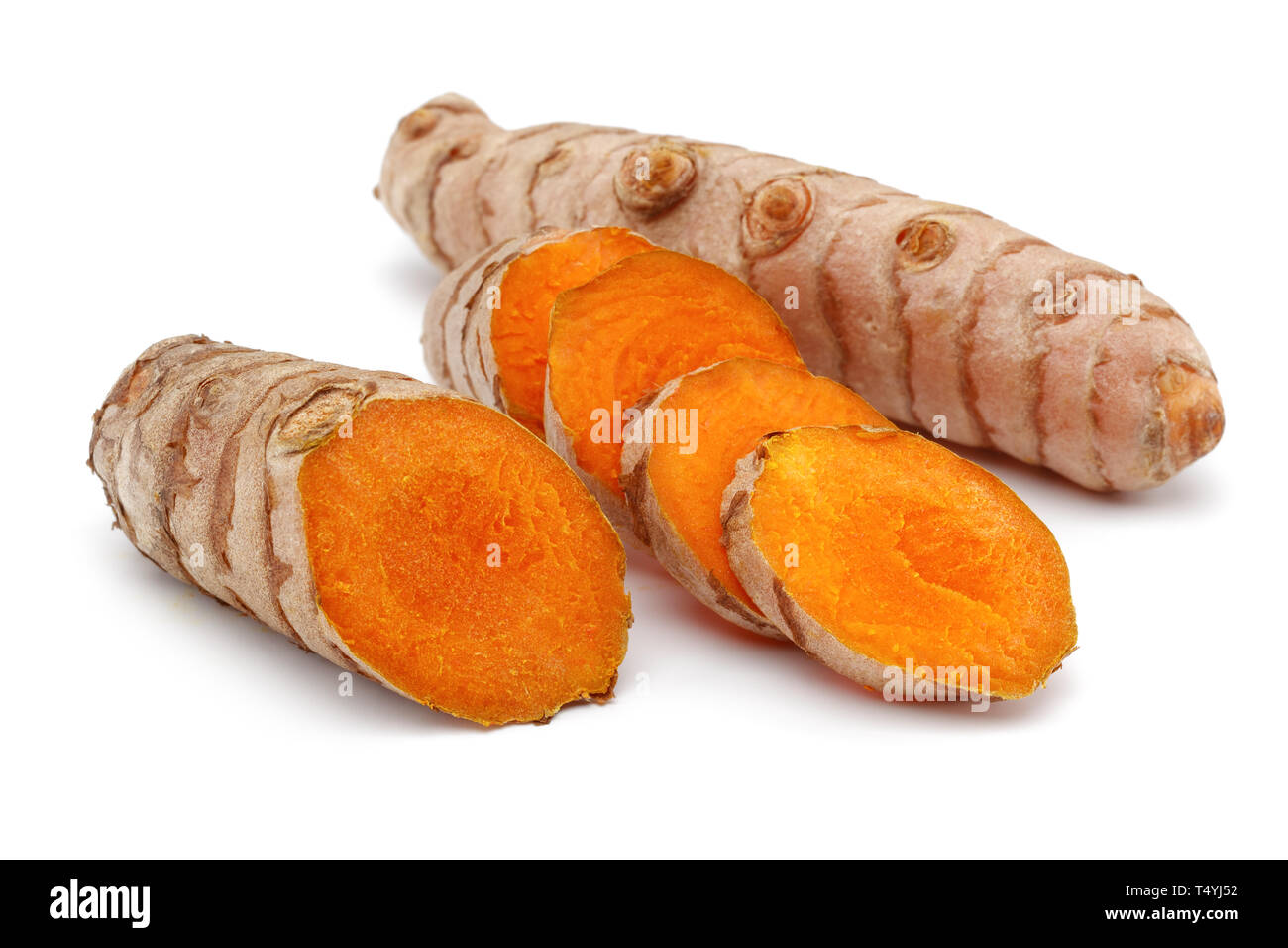 Fresh turmeric and slices isolated on white background Stock Photo - Alamy