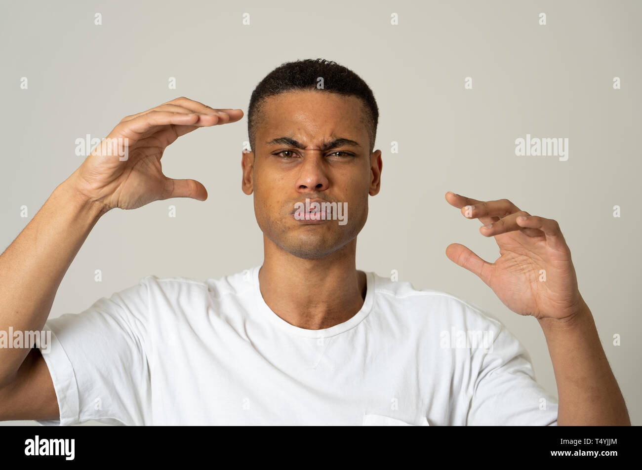 Portrait of young african american man feeling scared and shocked ...
