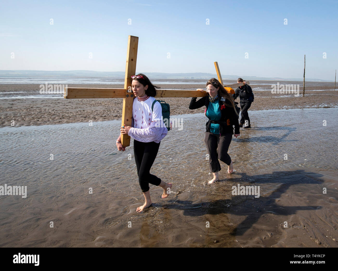 Pilgrims carrying crosses to the Holy Island of Lindisfarne in ...