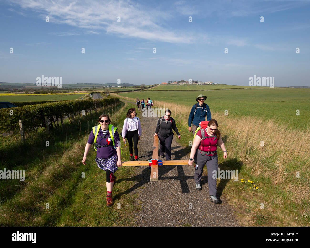 Pilgrims carrying crosses to the Holy Island of Lindisfarne in ...