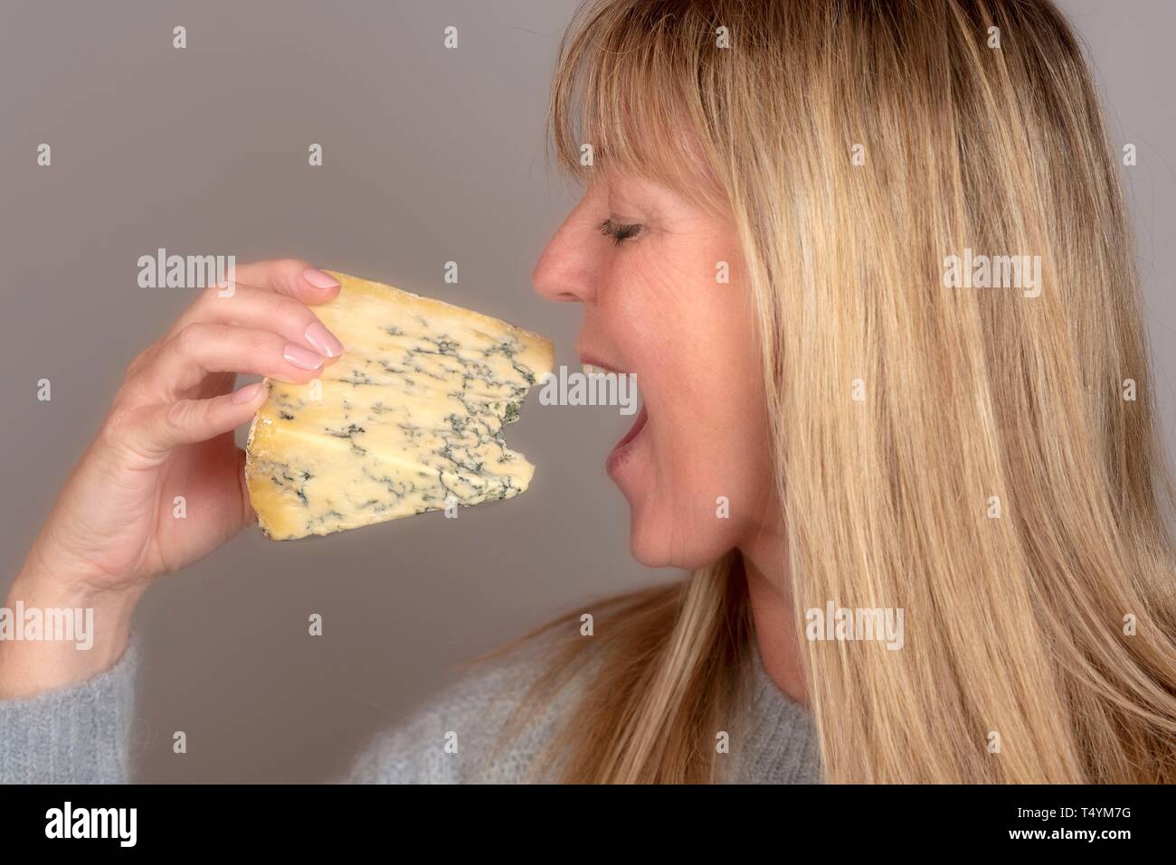 Cheese eating woman hi-res stock photography and images - Alamy