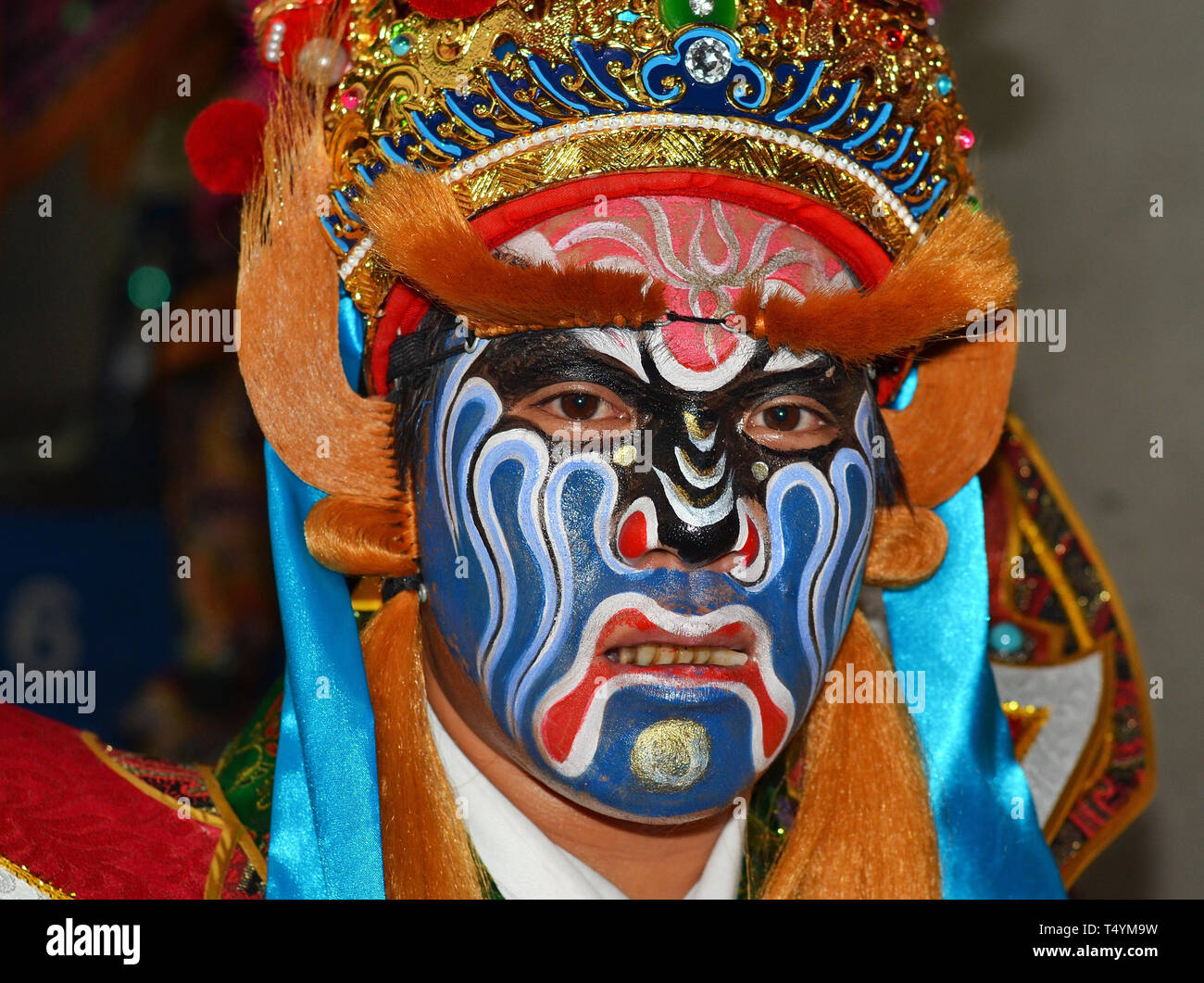 Young Taiwanese dancer wears traditional Taoist warrior face paint, a ...