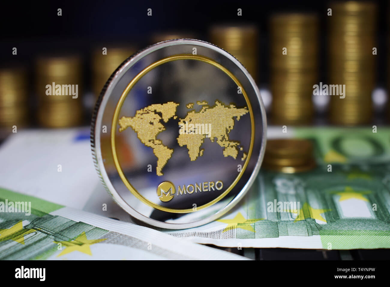 Coin physical Monero XMR on green banknote, background from golden ...