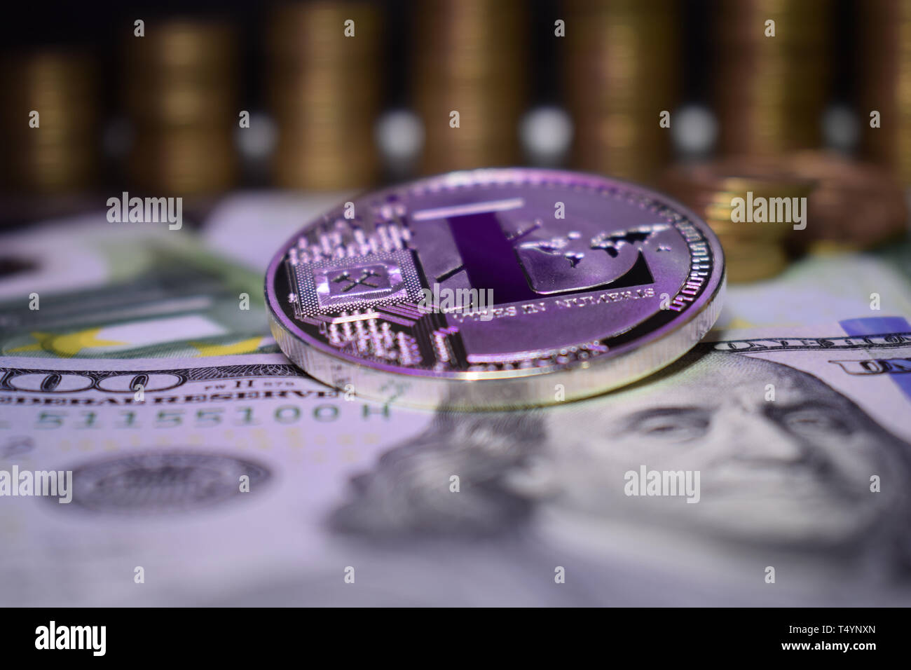 Coin physical Litecoin LTC, background from banknote and golden coins ...