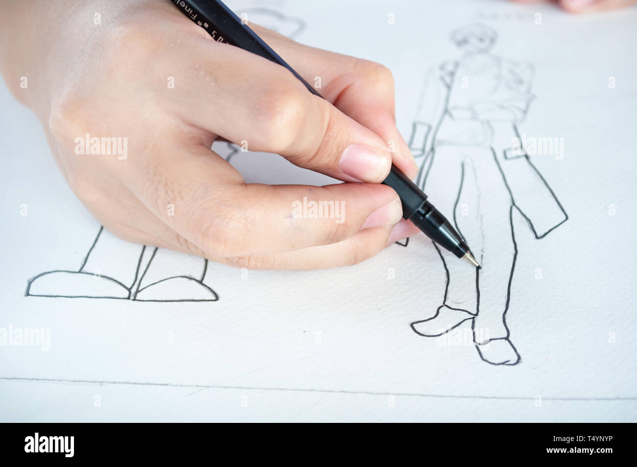 hand for drawing with pen on white paper background Stock Photo - Alamy