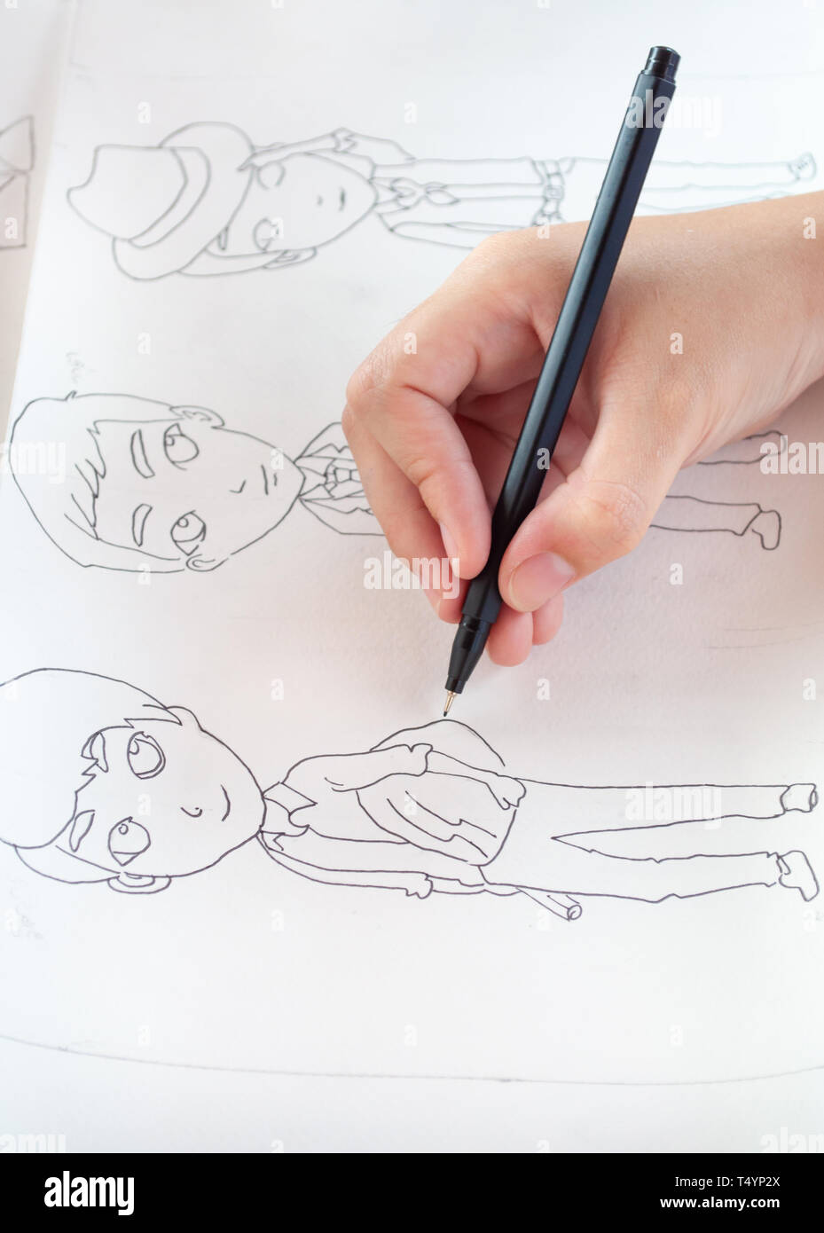 hand for drawing with pen on white paper background Stock Photo - Alamy