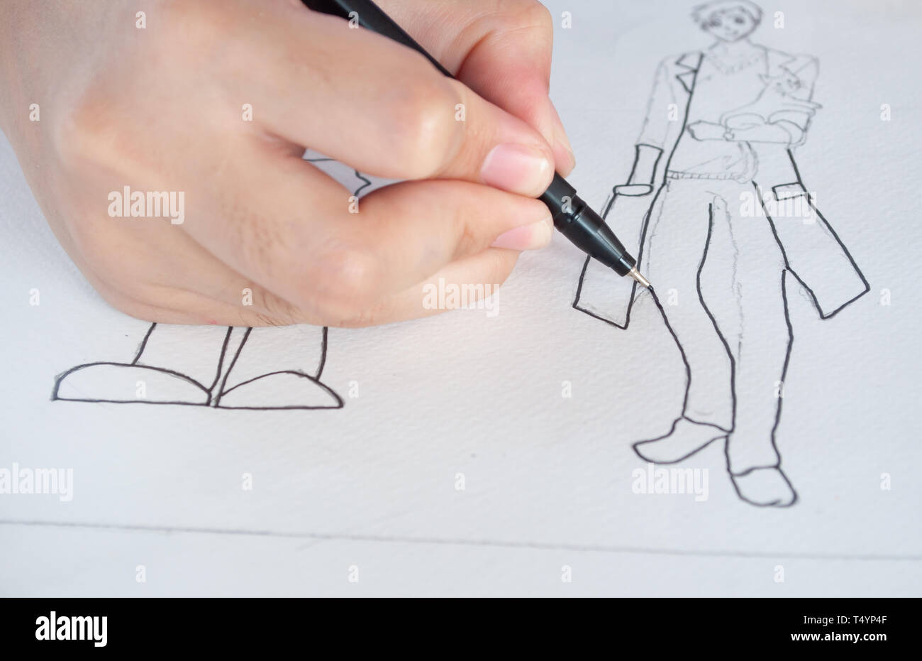 hand for drawing with pen on white paper background Stock Photo - Alamy