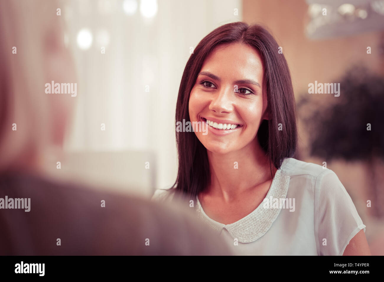 Positive delighted woman enjoying pleasant friendly talk Stock Photo ...