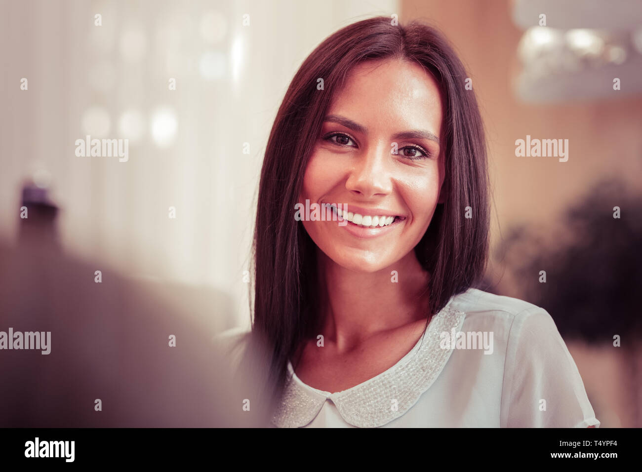 Beautiful young female person posing on camera Stock Photo - Alamy