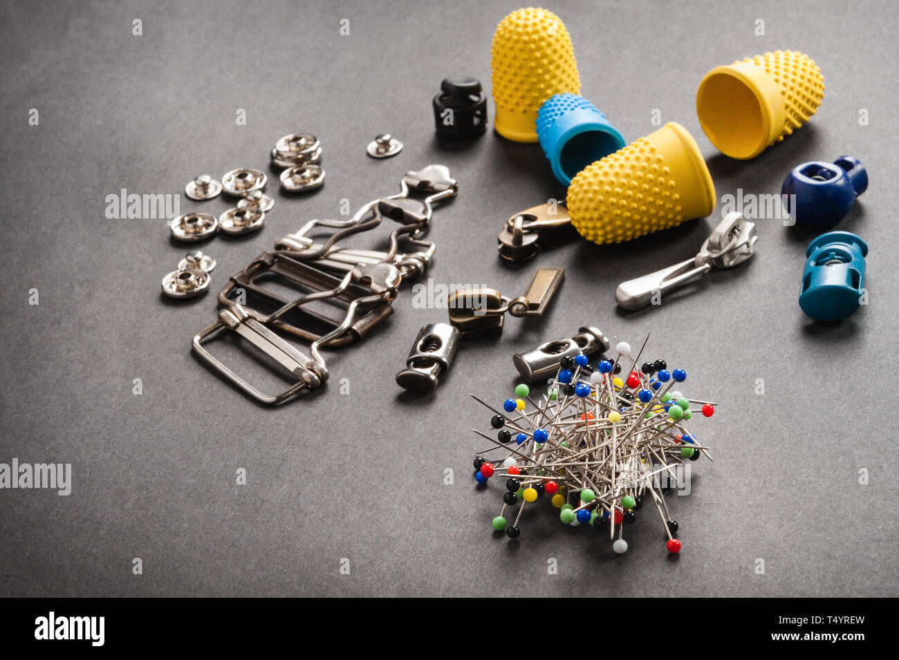 Sewing buttons on dark hi-res stock photography and images - Alamy